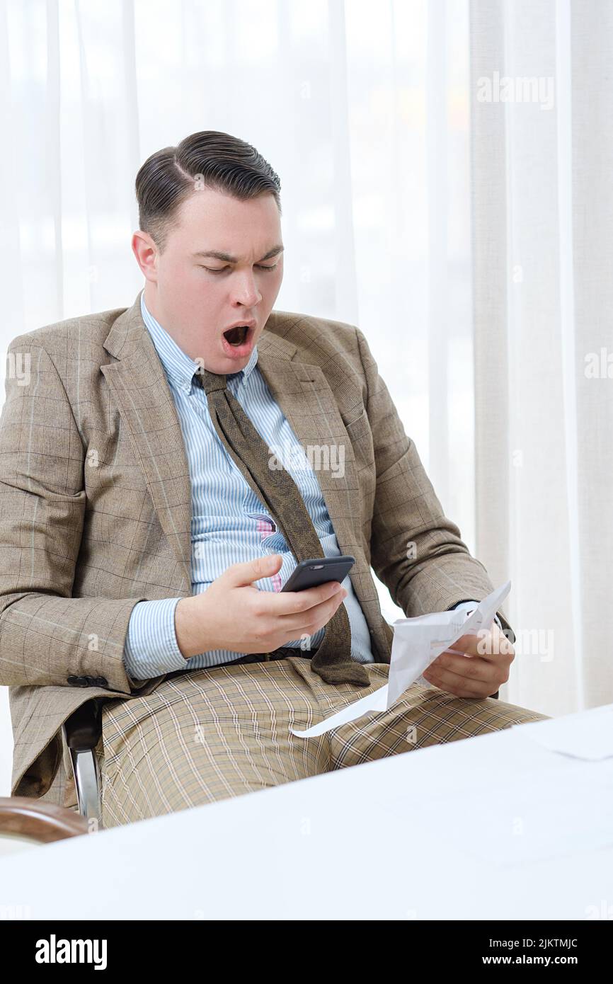 bored idle office worker yawning dull job Stock Photo - Alamy