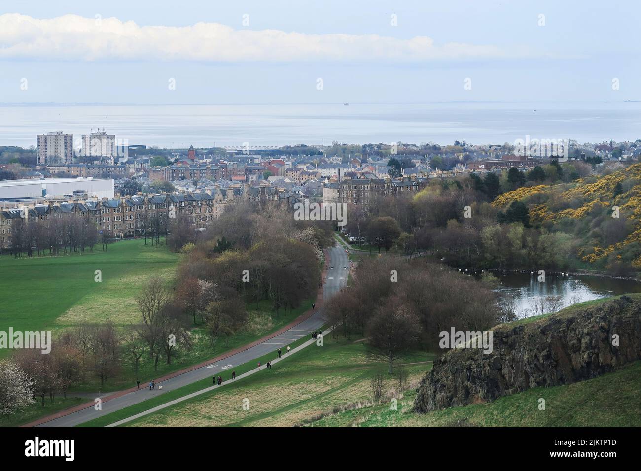 The bird's eye view of the green park with the lake against the ...