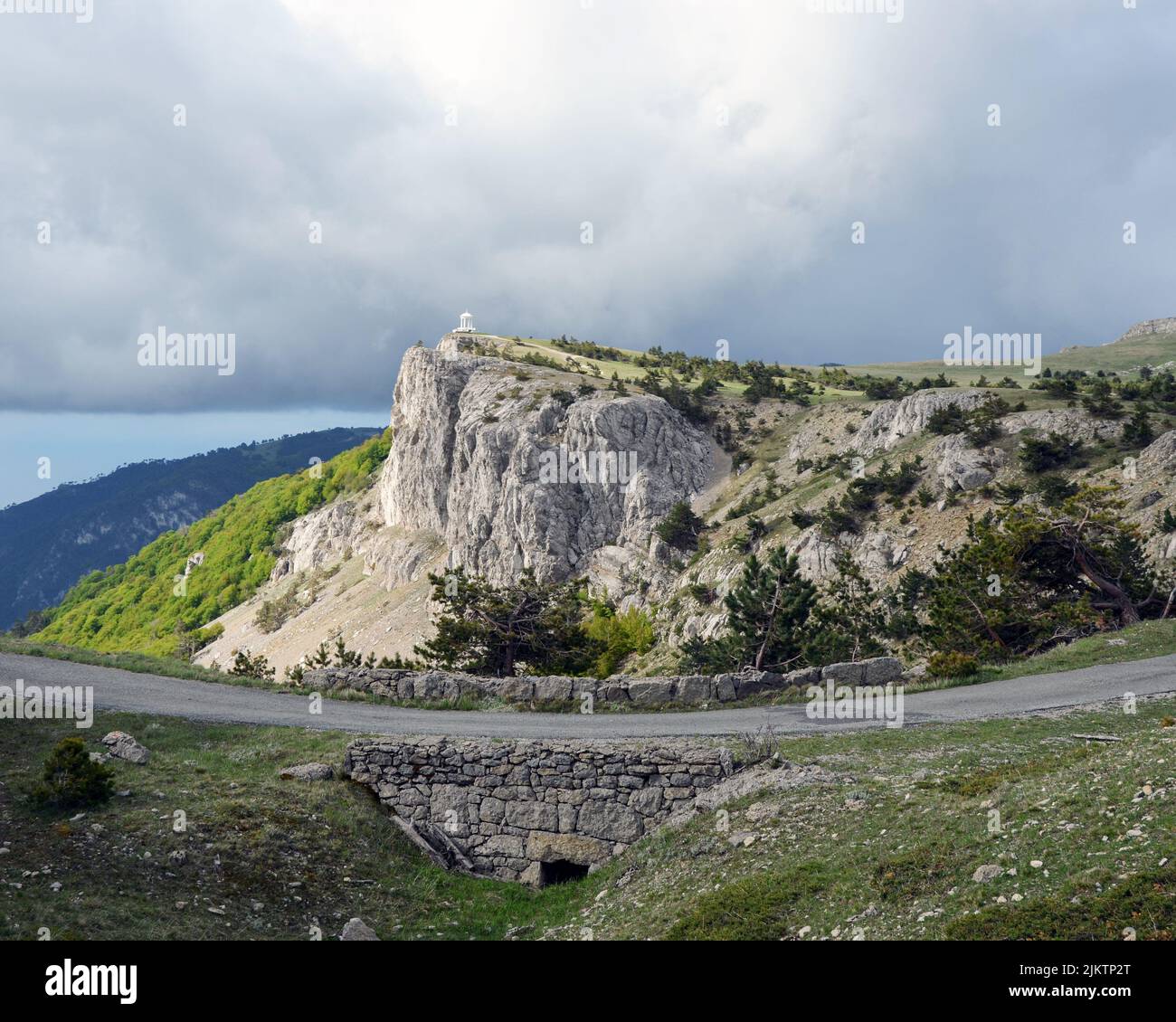 A view of a road stretching along rocks in a wild area with Rotunda on ...