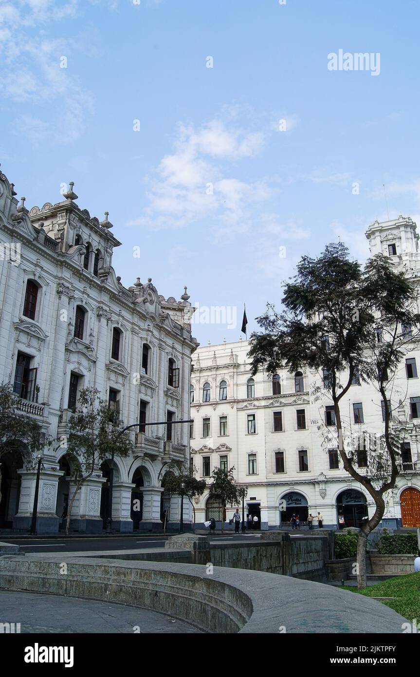 A vertical shot of historical colonial style buildings surrounding the ...