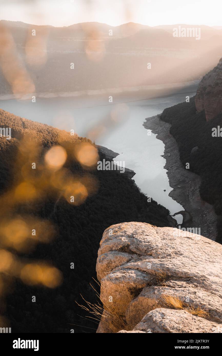 A vertical beautiful view from a cliff of a river and mountains Stock ...