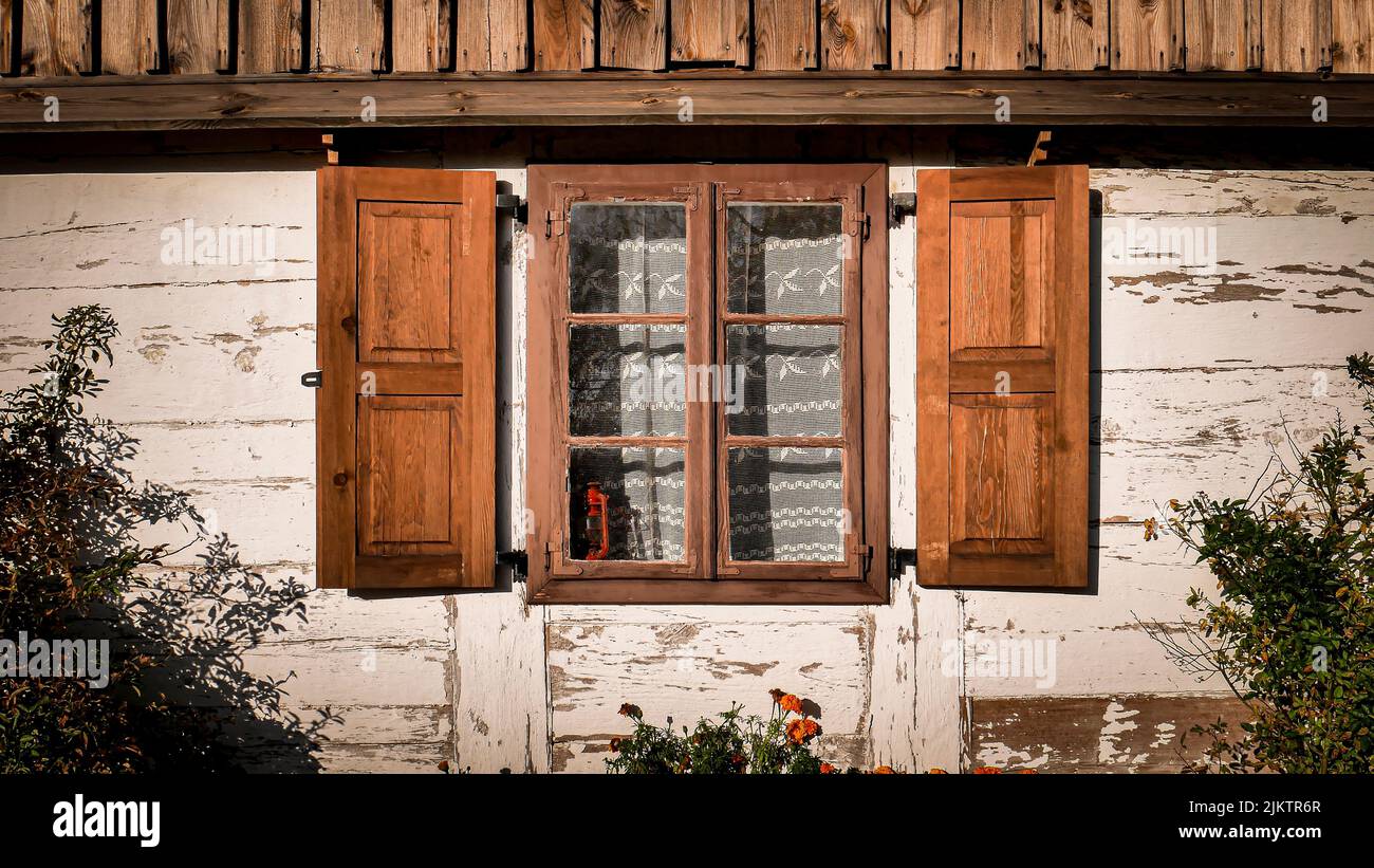 A front view of an old wooden house under sunlight Stock Photo - Alamy