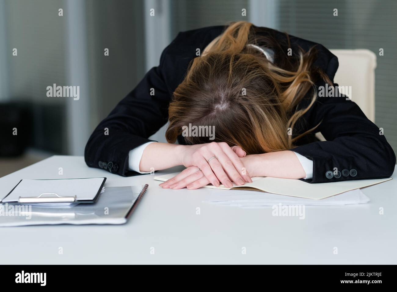 stress deadline overworking exhausted woman desk Stock Photo - Alamy