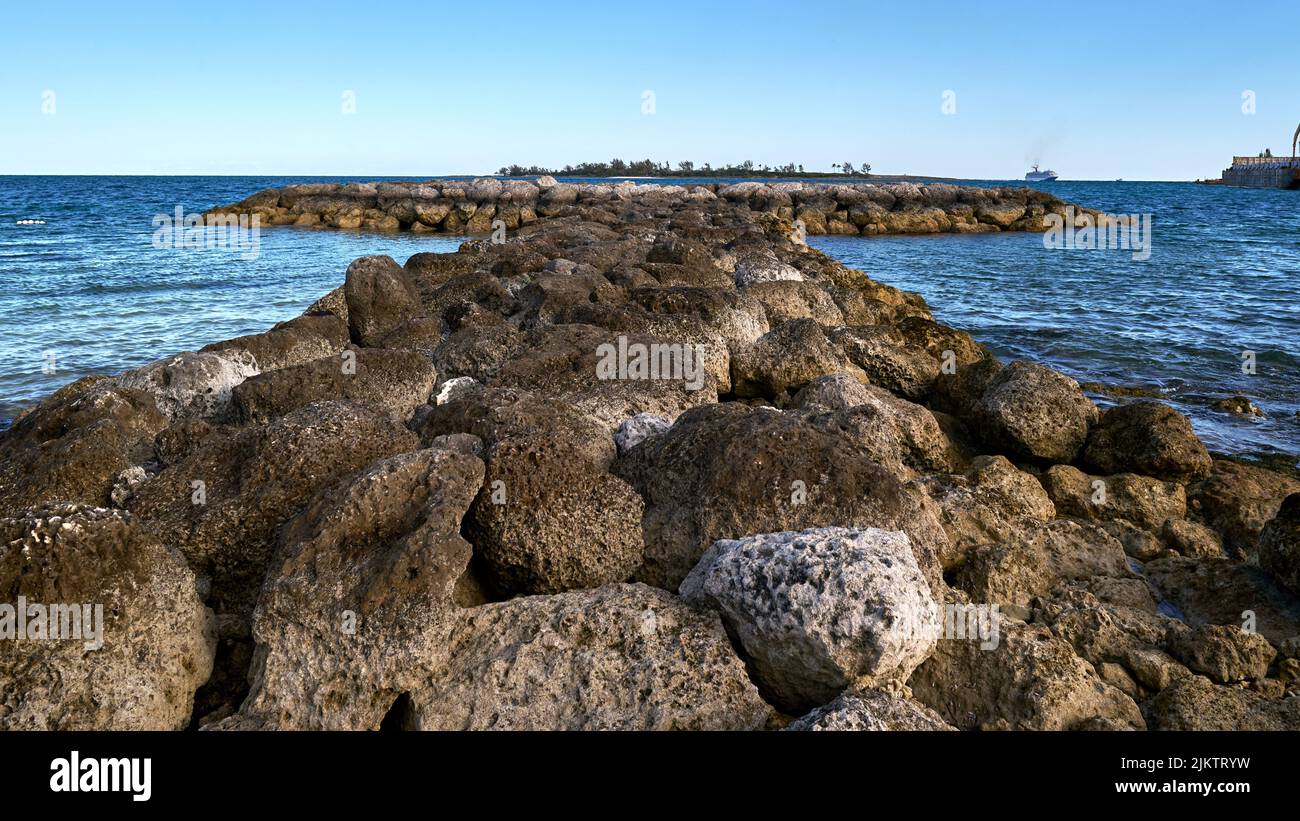 The close-up shot of a small stone path island on a sea Stock Photo - Alamy
