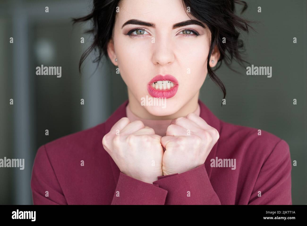 emotion face angry mad cross furious clenched fist Stock Photo - Alamy