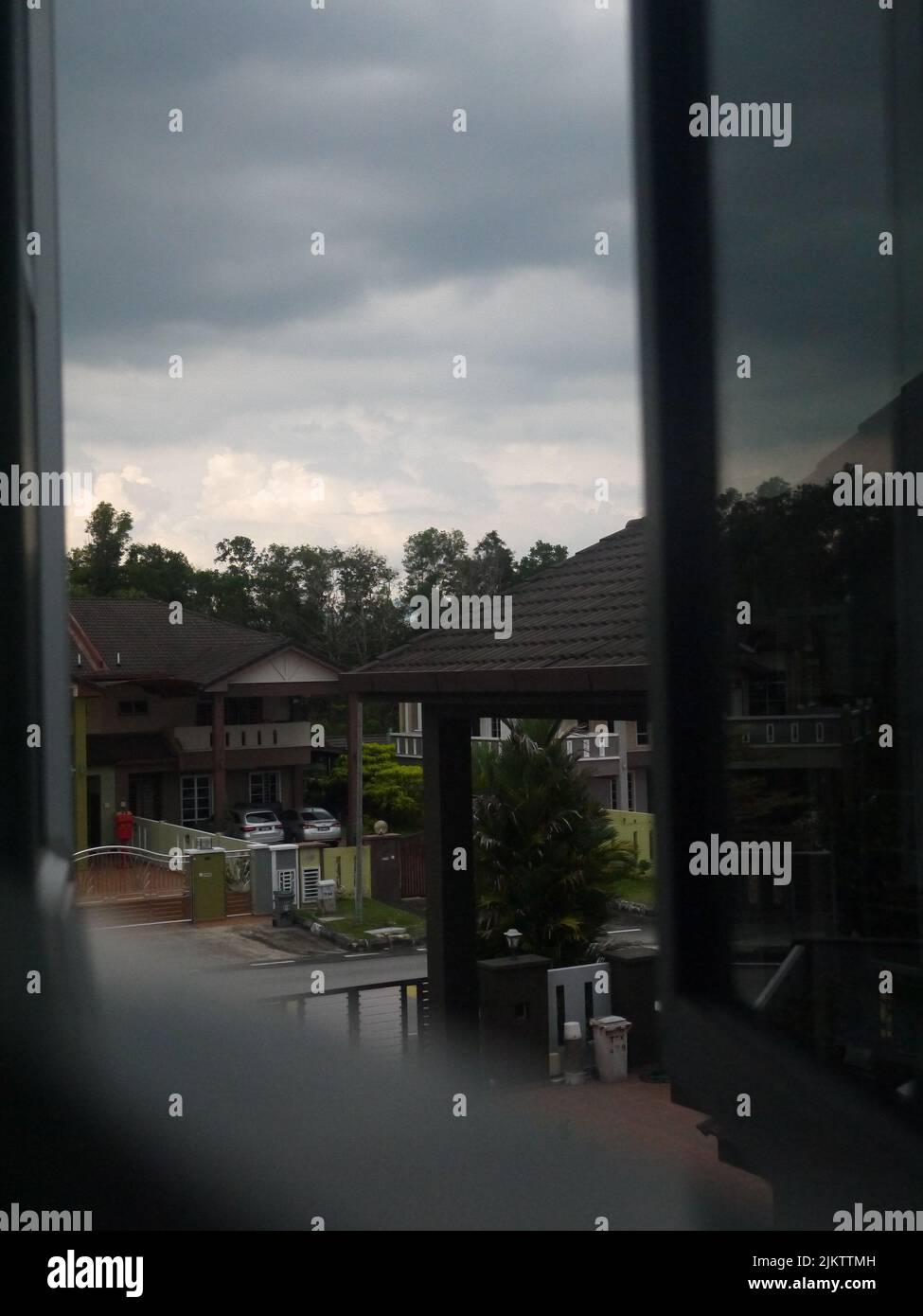 A vertical shot of a neighborhood seen from window of house Stock Photo ...