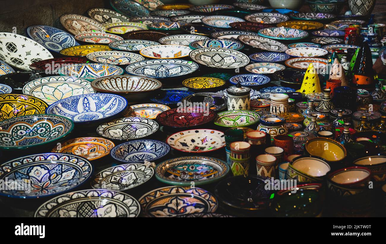 A wide assortment of painted oriental pottery at the market Stock Photo ...