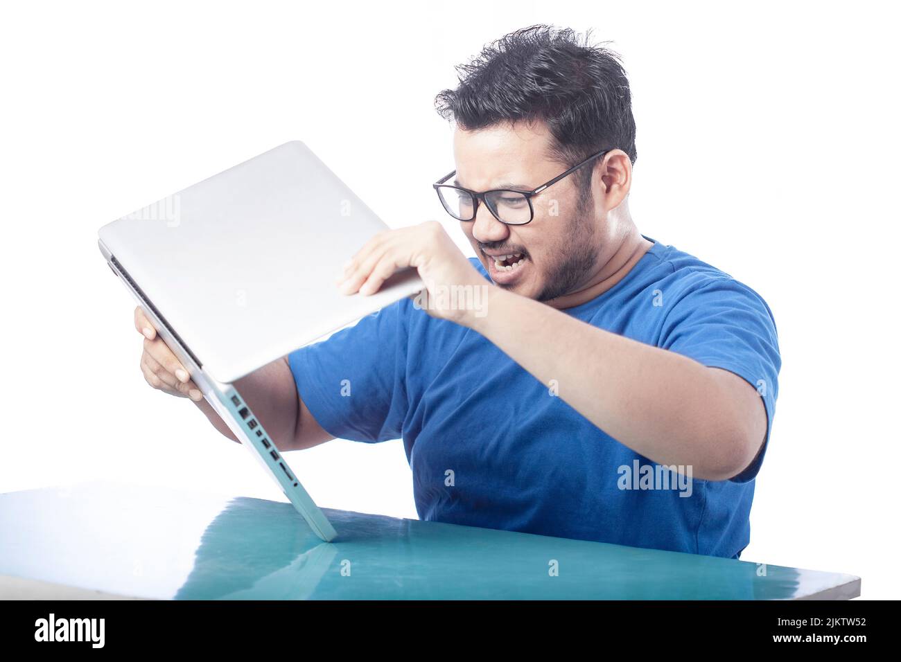 angry student hate technology and breaking laptop with shrieking ...