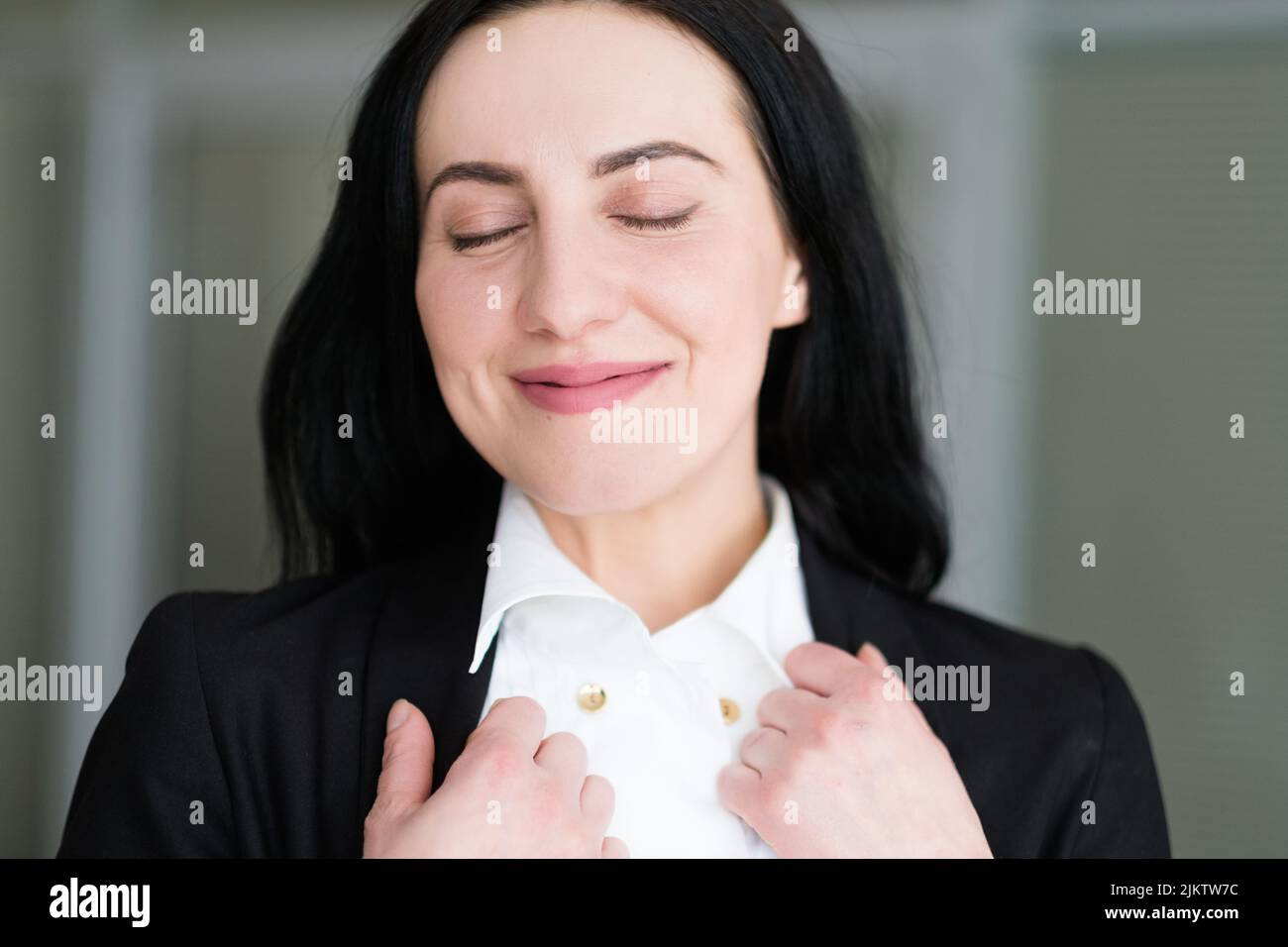 emotion face smiling woman pleased closed eyes Stock Photo - Alamy