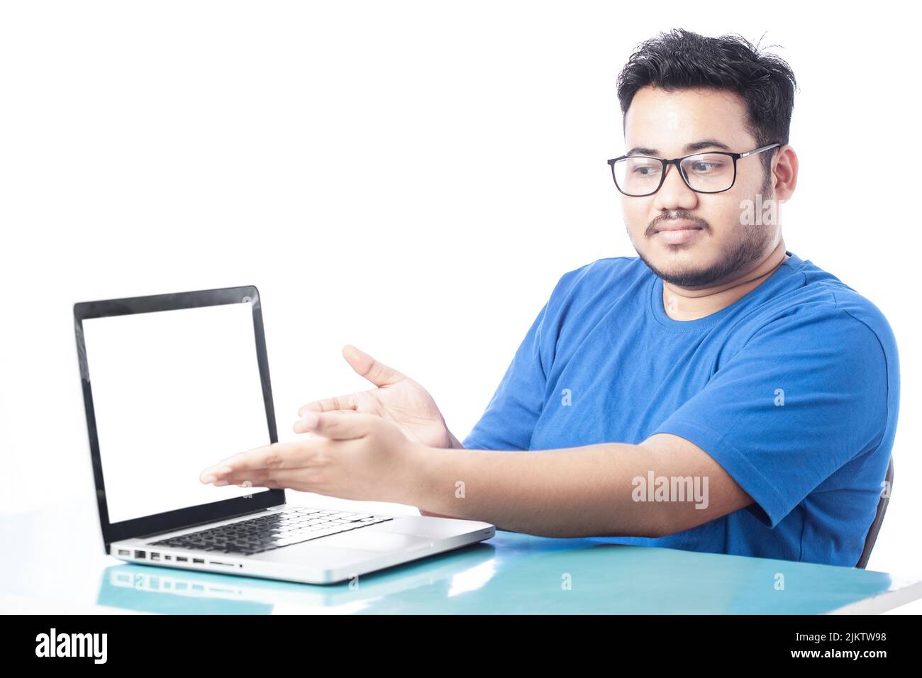 young man pointing hands towards blank laptop screen Stock Photo - Alamy