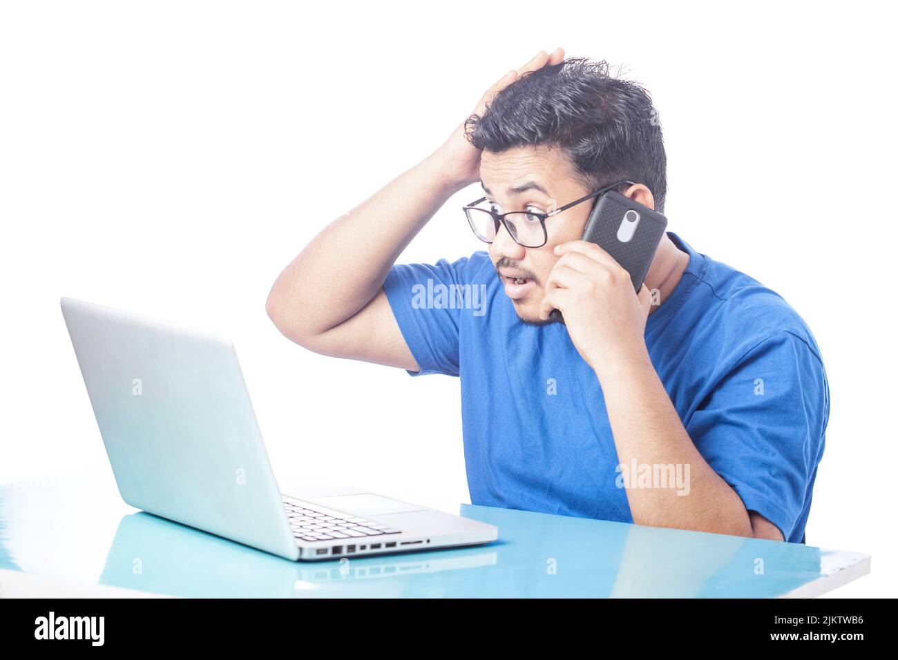 corporate man talking over phone and shocking reaction after looking a ...