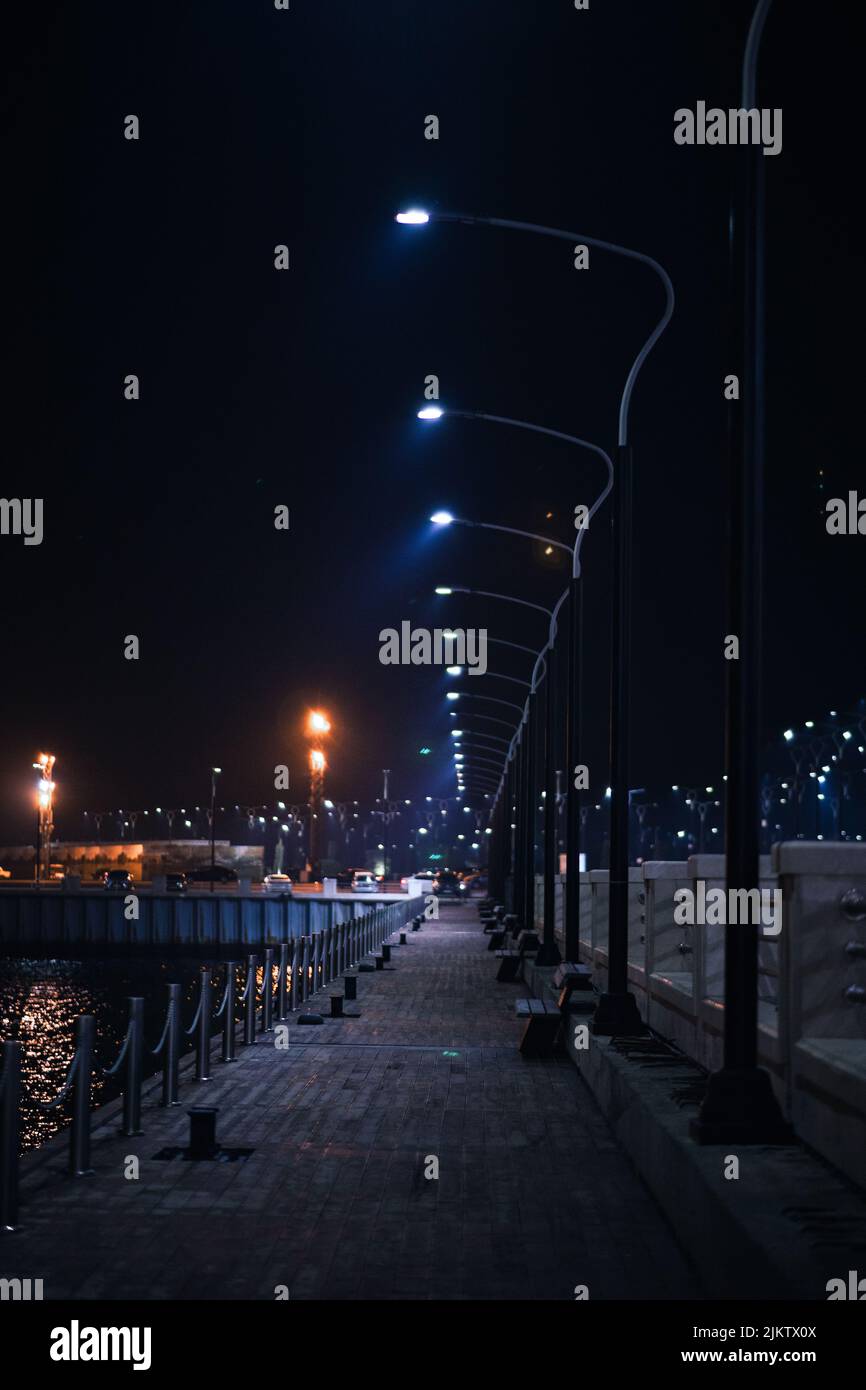 A vertical shot of street lights on a road at night in Baku, Azerbaijan ...