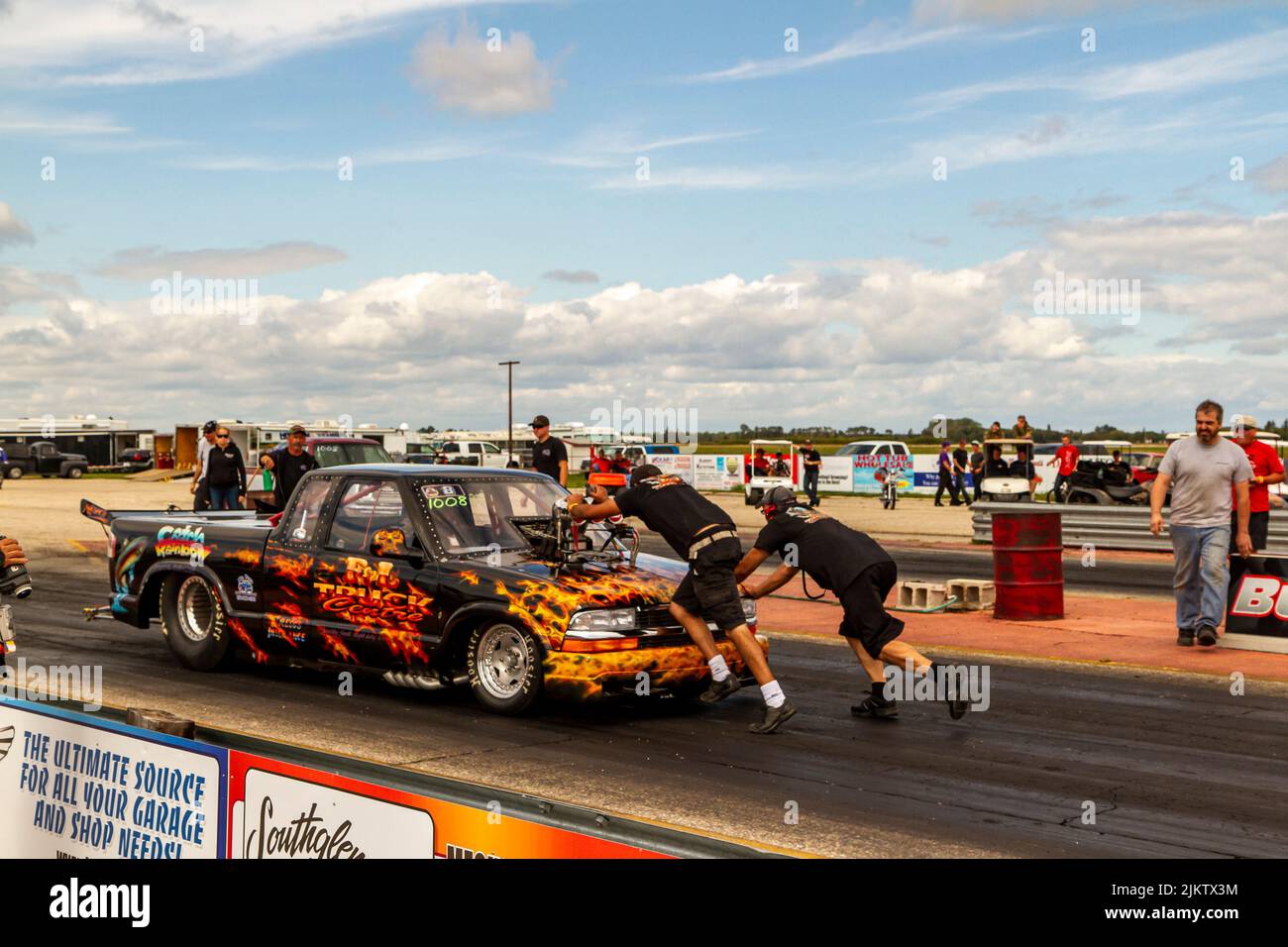 Dragster being pushed back by the crew after the burnout Stock Photo ...