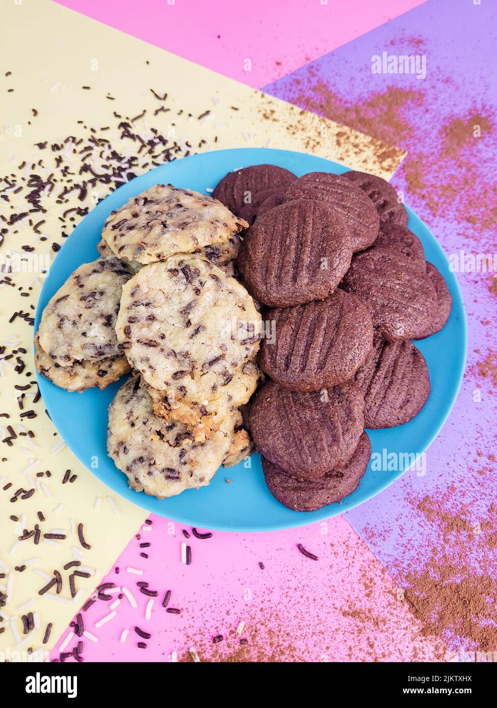 A top view of two kinds of sweet cookies with chocolate and white cream ...