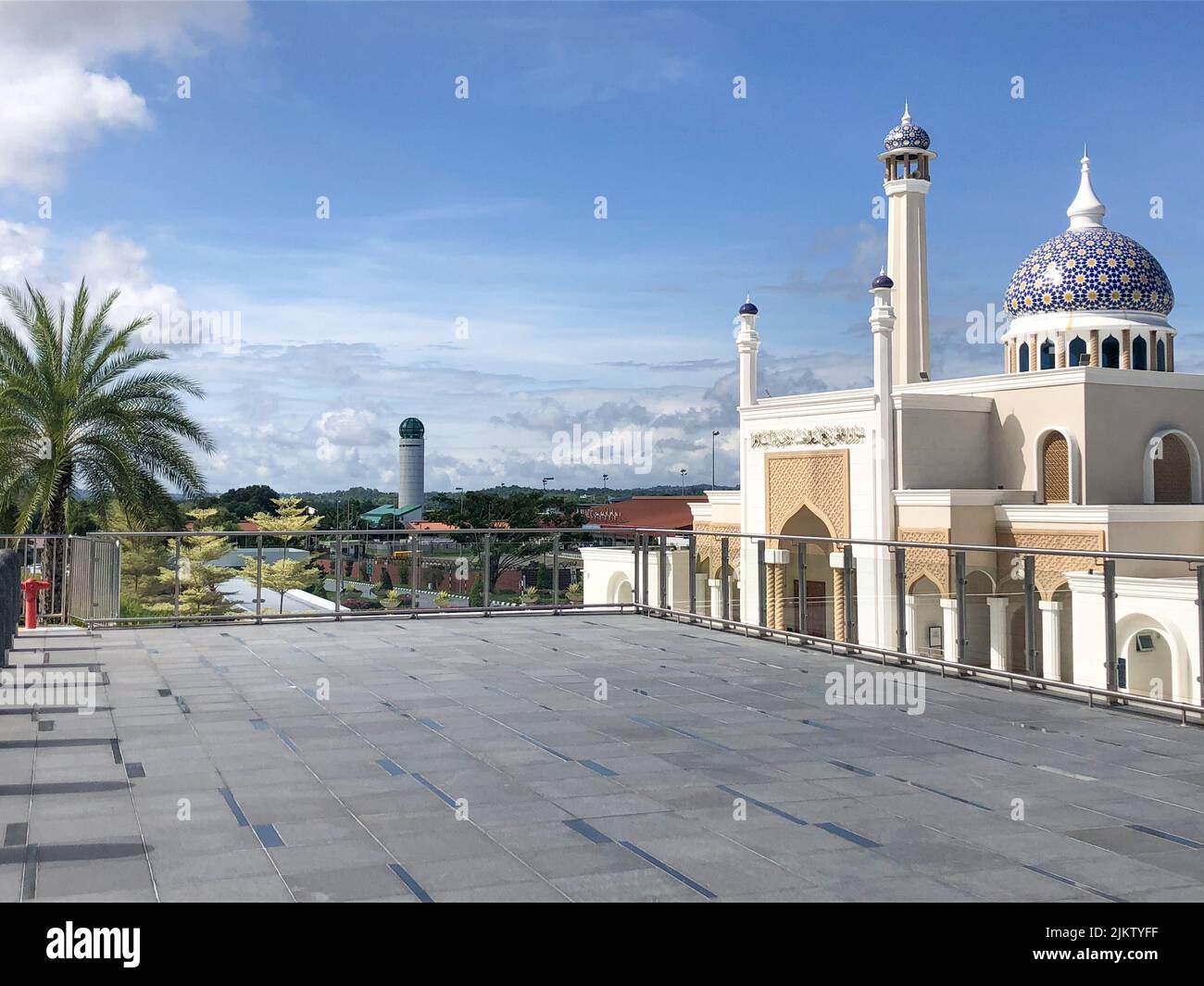 The Brunei International Airport Mosque on a blue cloudy skybackground ...