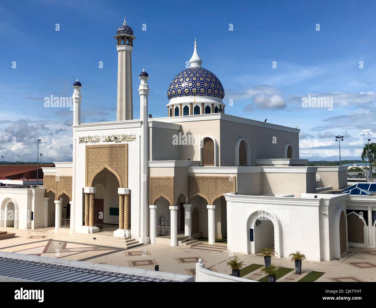 The Brunei International Airport Mosque on a blue cloudy skybackground ...