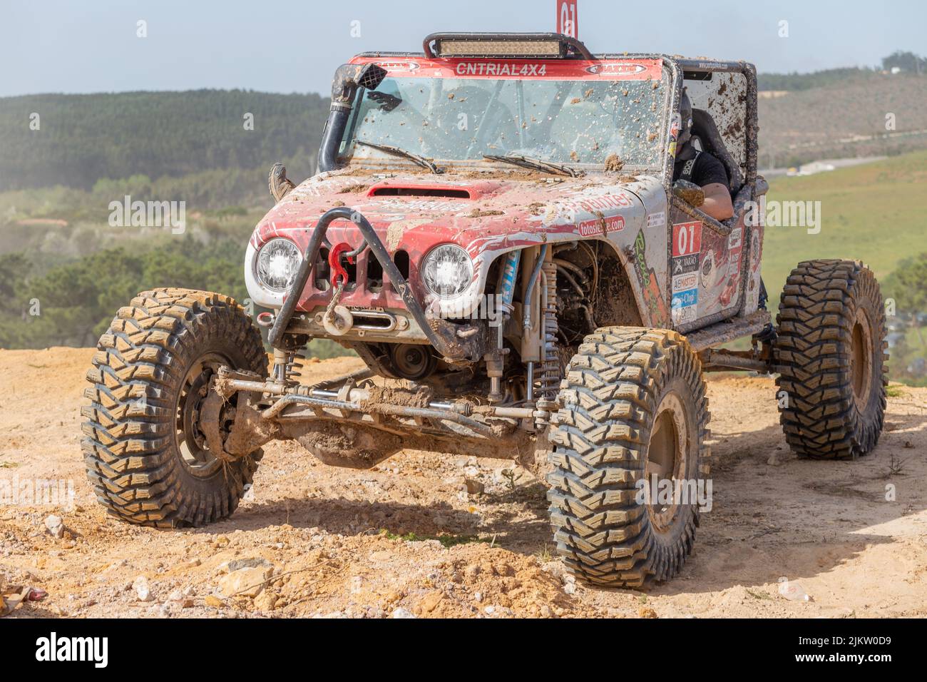 An Off-road racing car covered with mud during National All Terrain ...