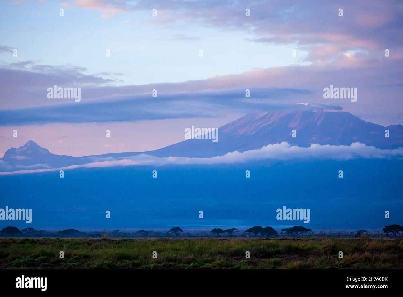 Mount Kilimanjaro and Mount Meru viewed from the Amboseli Kenya Stock ...