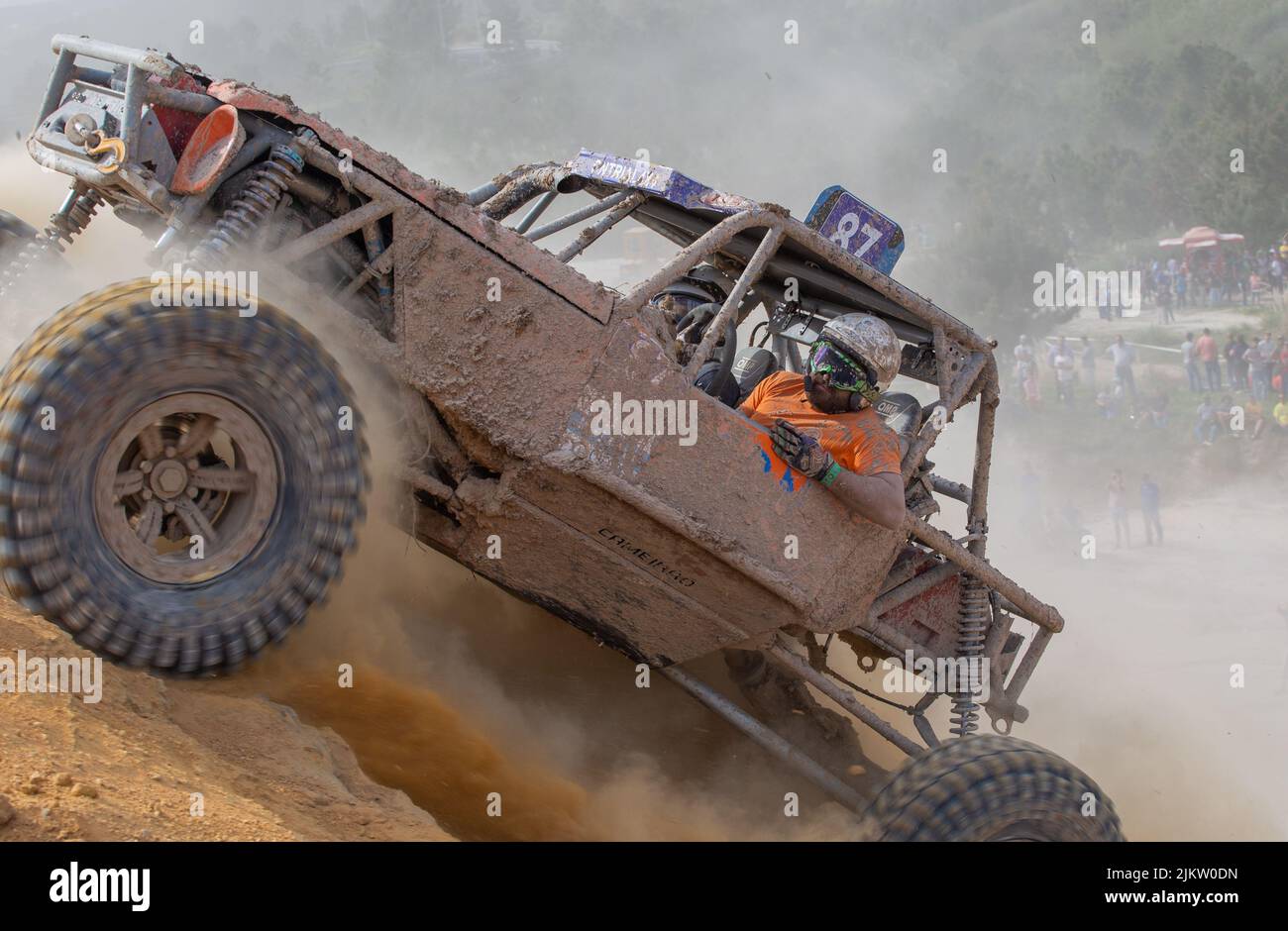 An off-road racing car covered with mud during National All Terrain ...