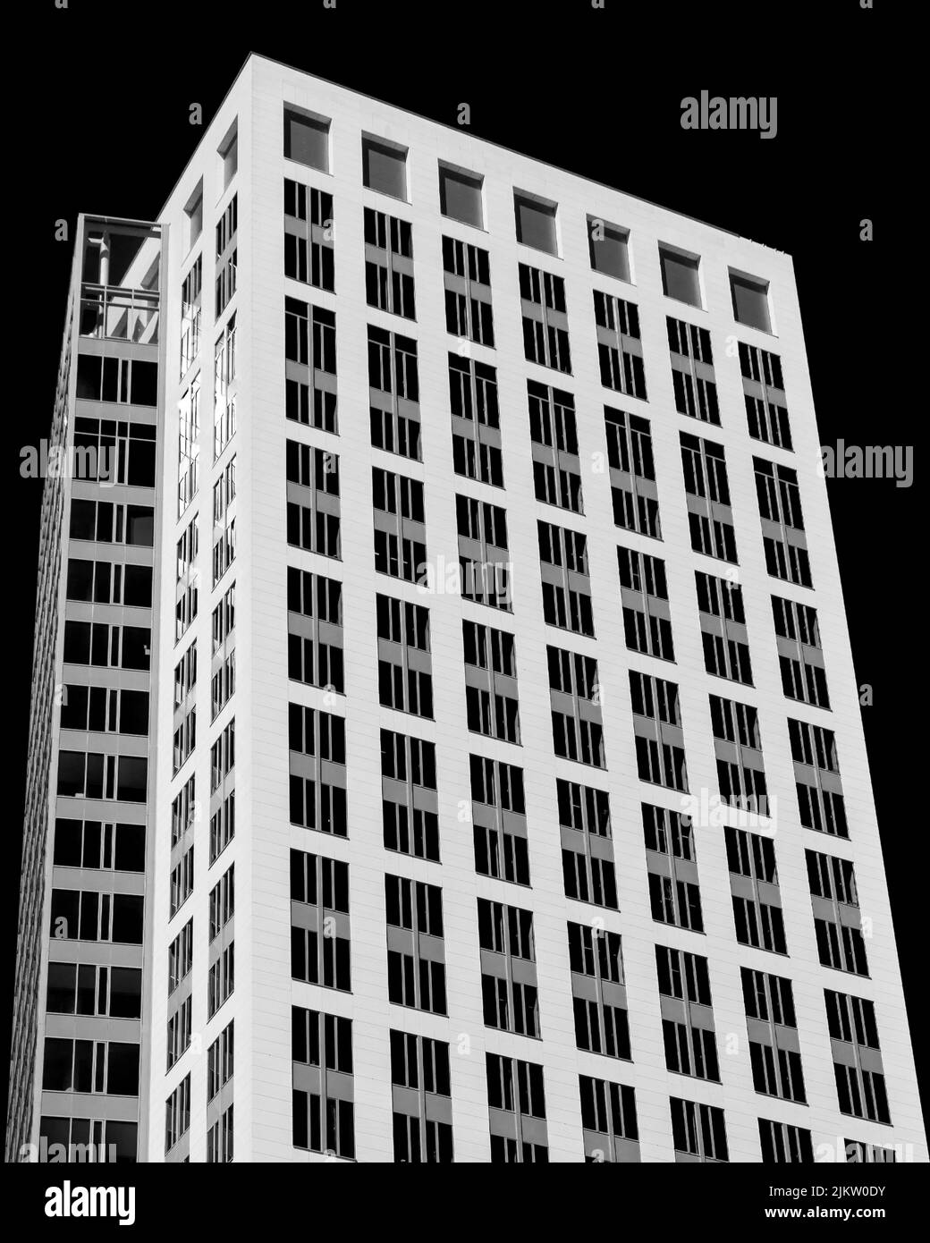 A vertical grayscale low angle view of a modern housing estate on the ...