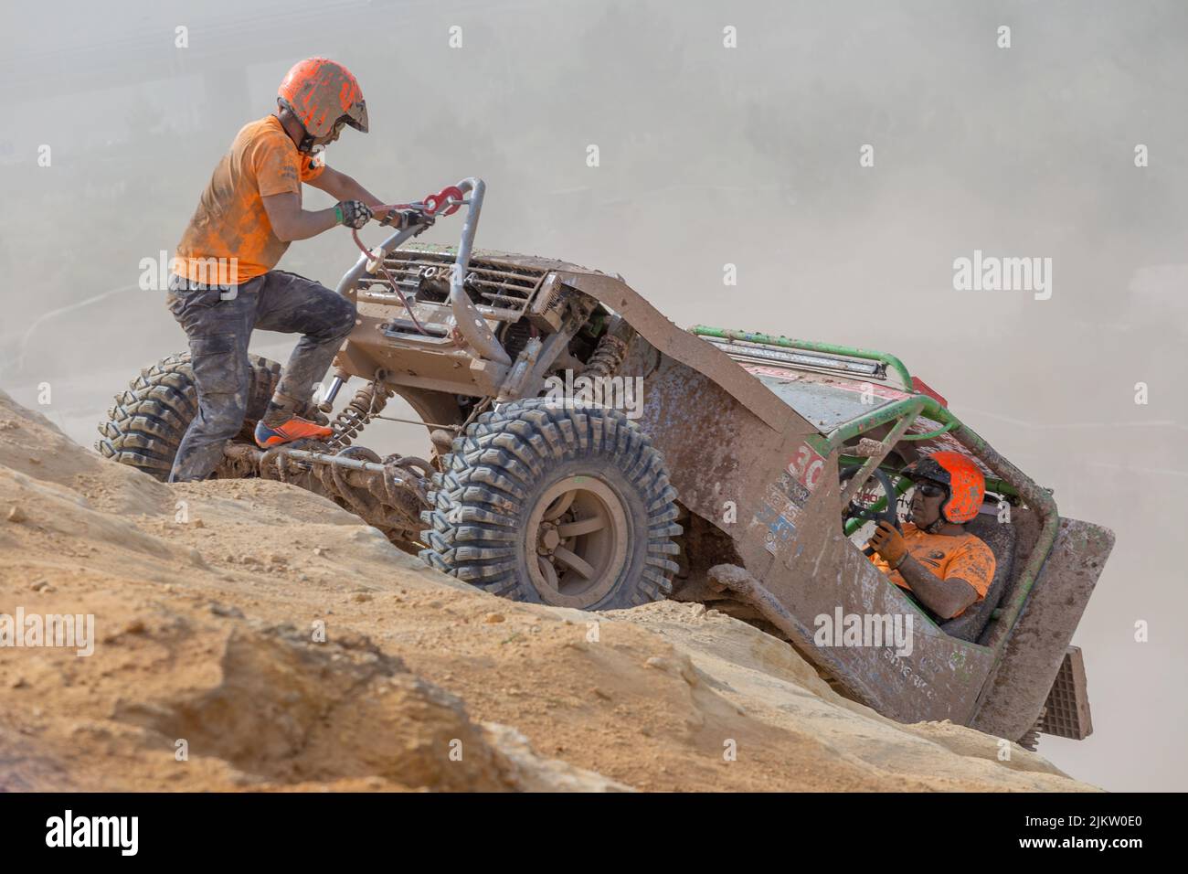 An off-road racing car covered with mud during National All Terrain ...