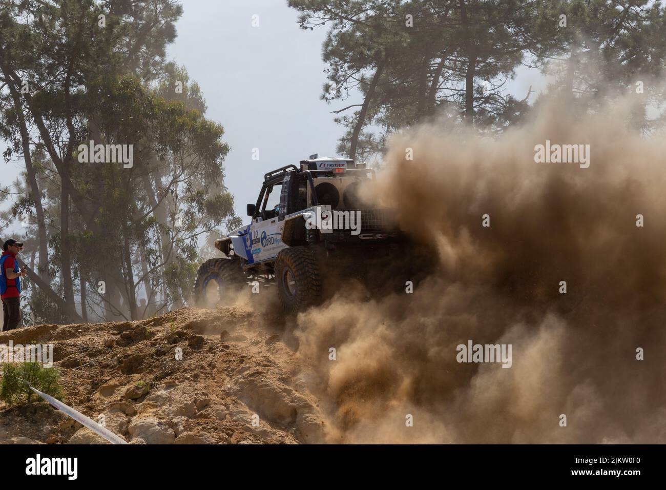 An off-road racing car covered with mud during National All Terrain ...