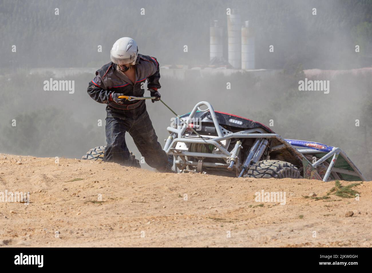 An Off-road racing car covered with mud during National All Terrain ...