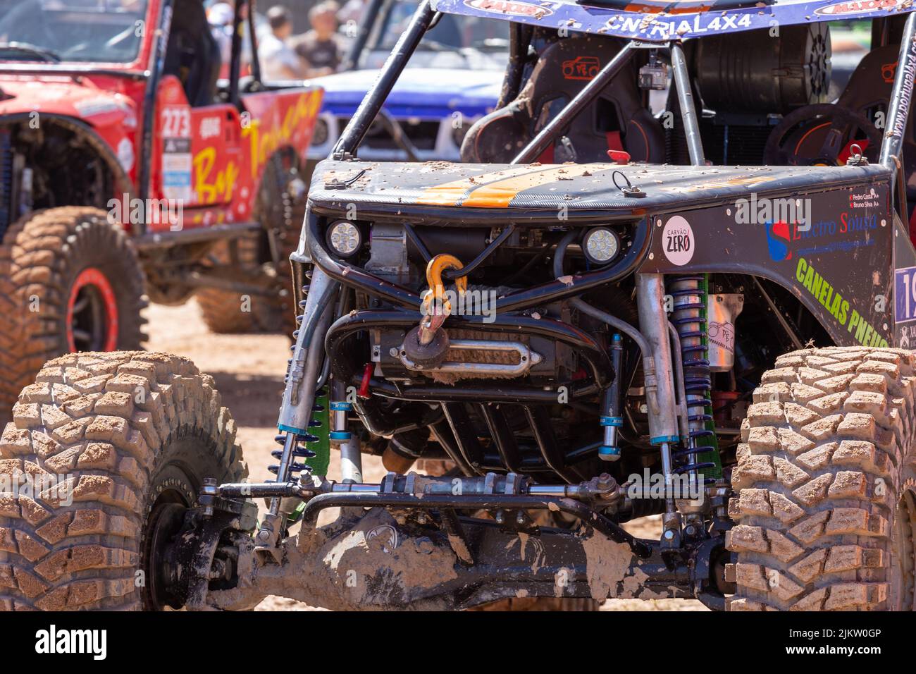 An off-road racing car covered with mud during National All Terrain ...