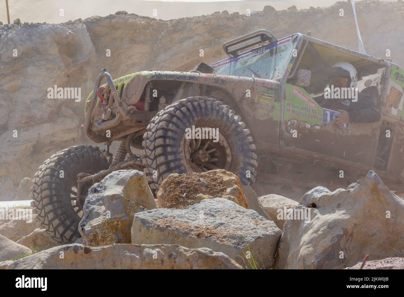 An Off-road racing car covered with mud during National All Terrain ...