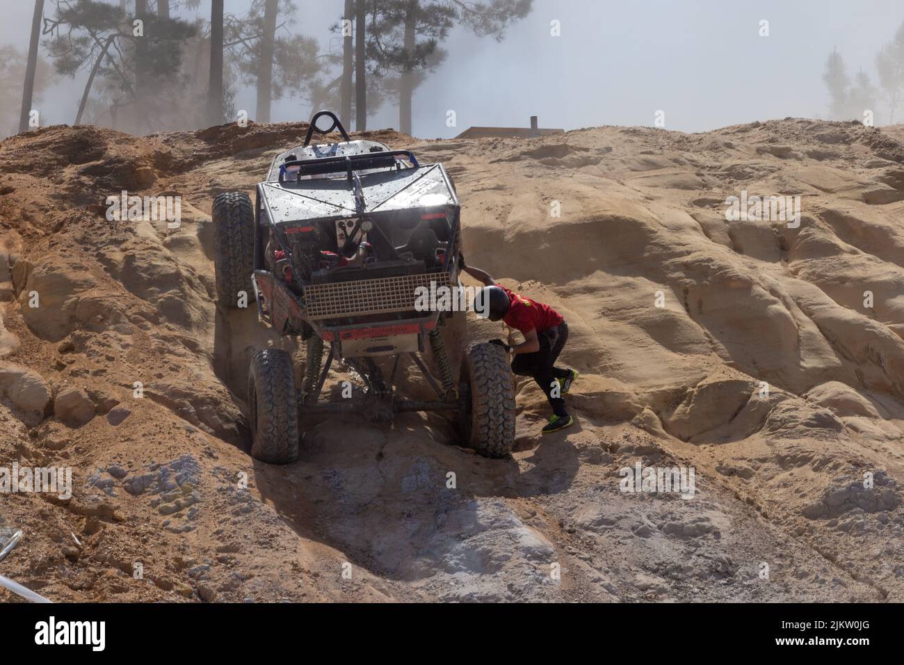 An off-road racing car covered with mud during National All Terrain ...