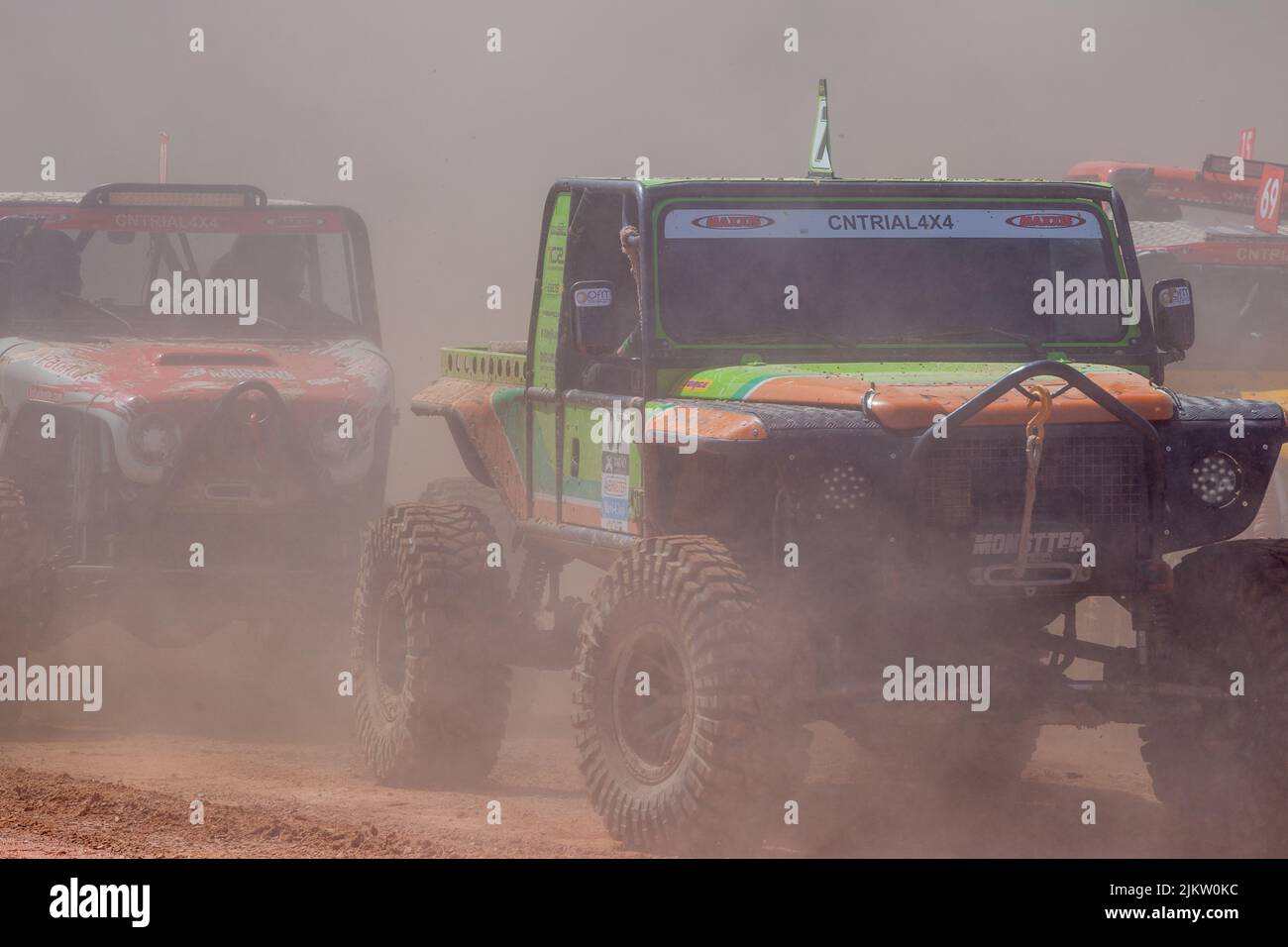 An off-road racing car covered with mud during National All Terrain ...