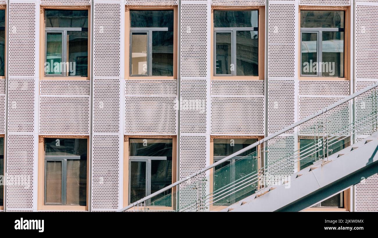 The facade of a stairway and a building with glass windows Stock Photo ...