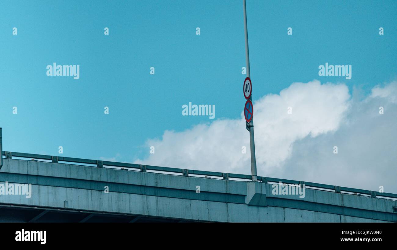 The road signs of speed limit forty and no parking on the bridge ...