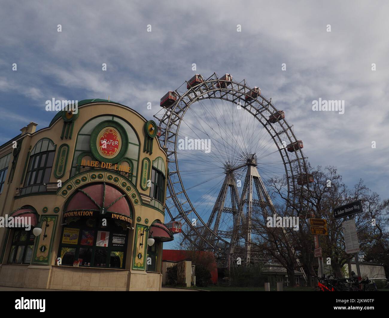 Prater entry with ferris wheel in the back, famous amusement park ...