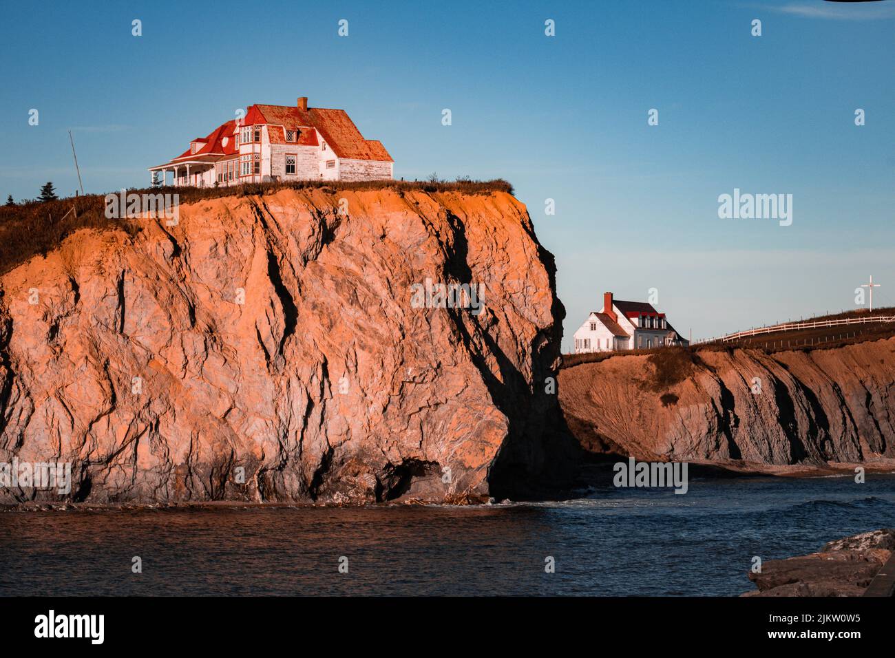A beautiful view of house buildings on high cliffs above the sea under ...