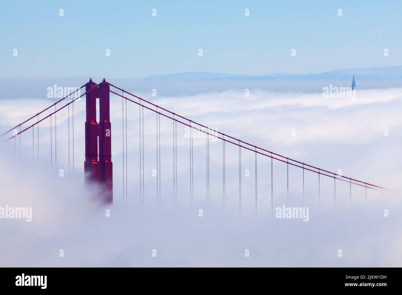 An incredible fog over Golden Gate Bridge in San Francisco, California ...