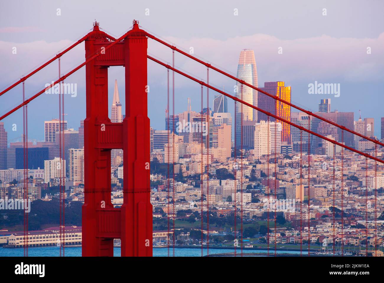 A famous Golden Gate Bridge with buildings in the background in San ...
