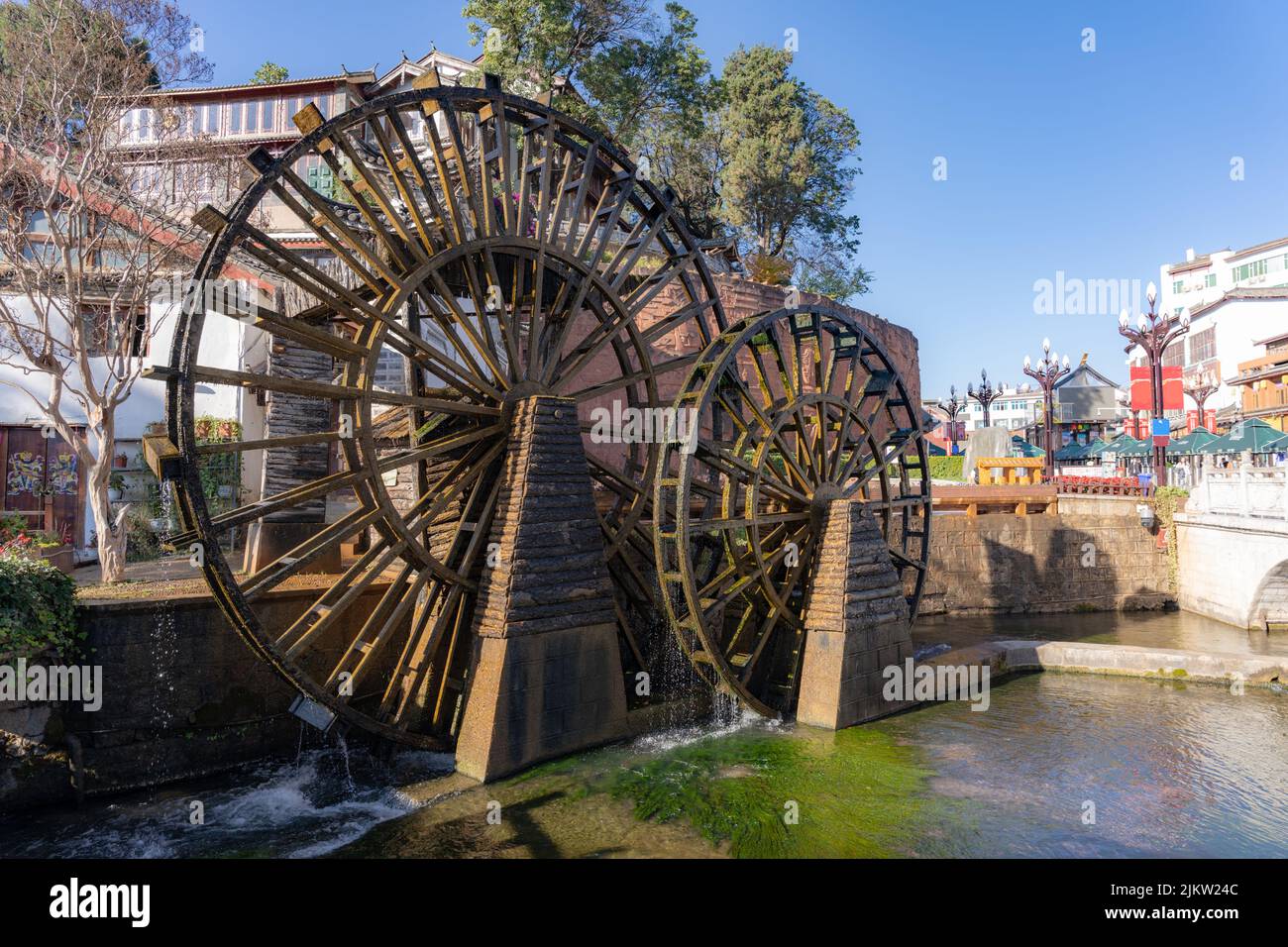 The wooden wheels of a water mill in a square of the ancient city of ...