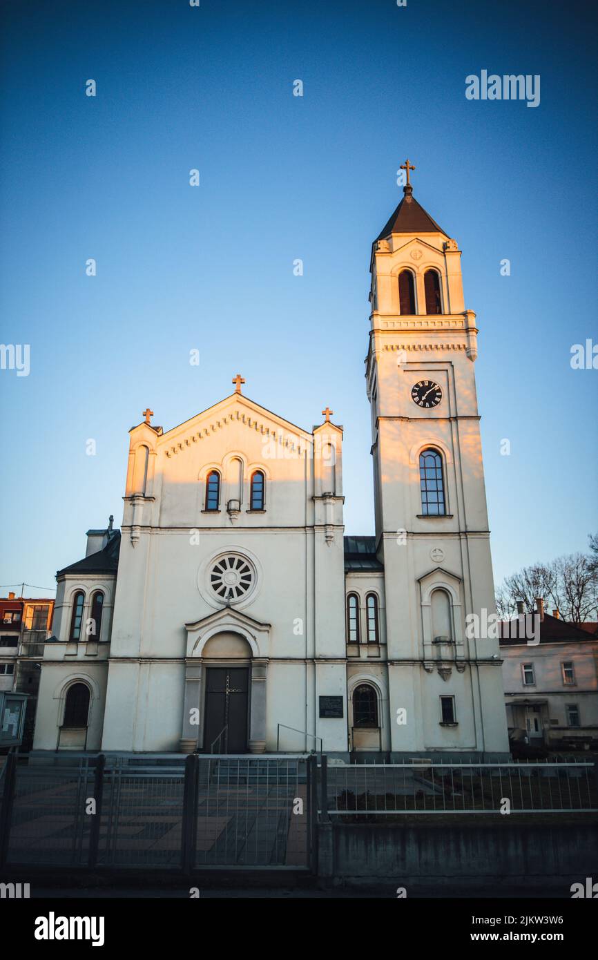 A vertical shot of the Exterior design of catholic church in Brcko with ...