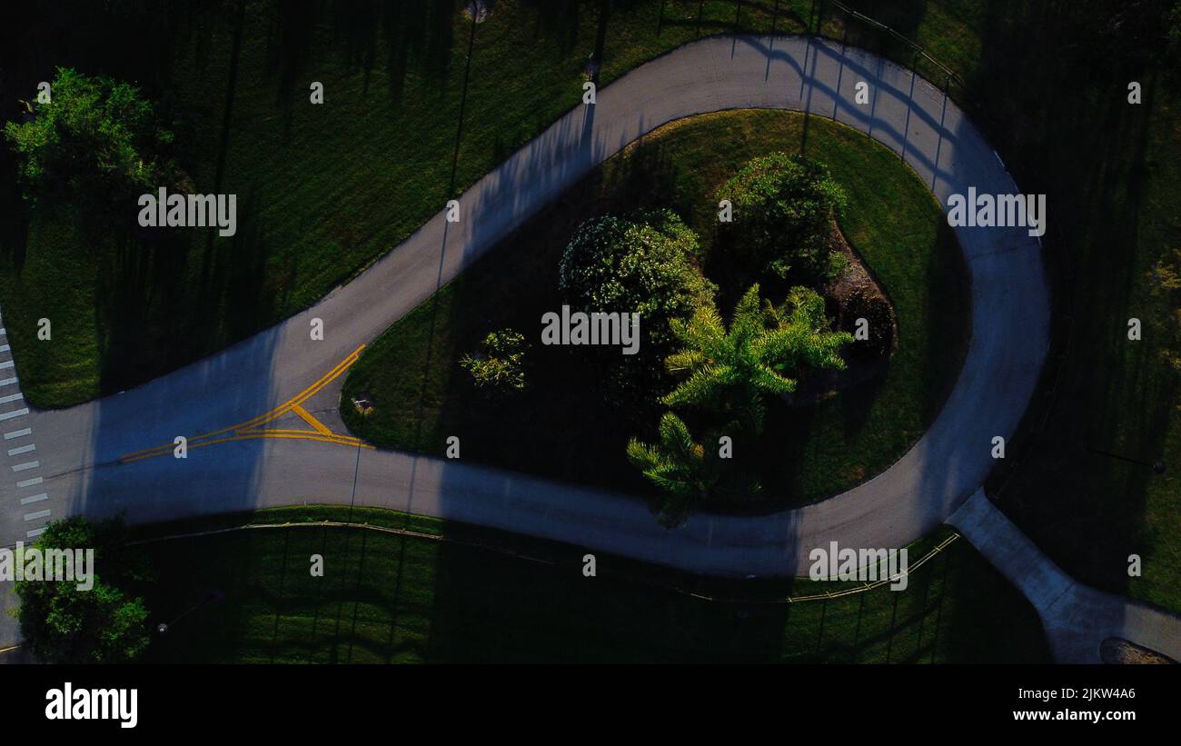 An aerial view of the roundabout road surrounded by greenery Stock Photo - Alamy