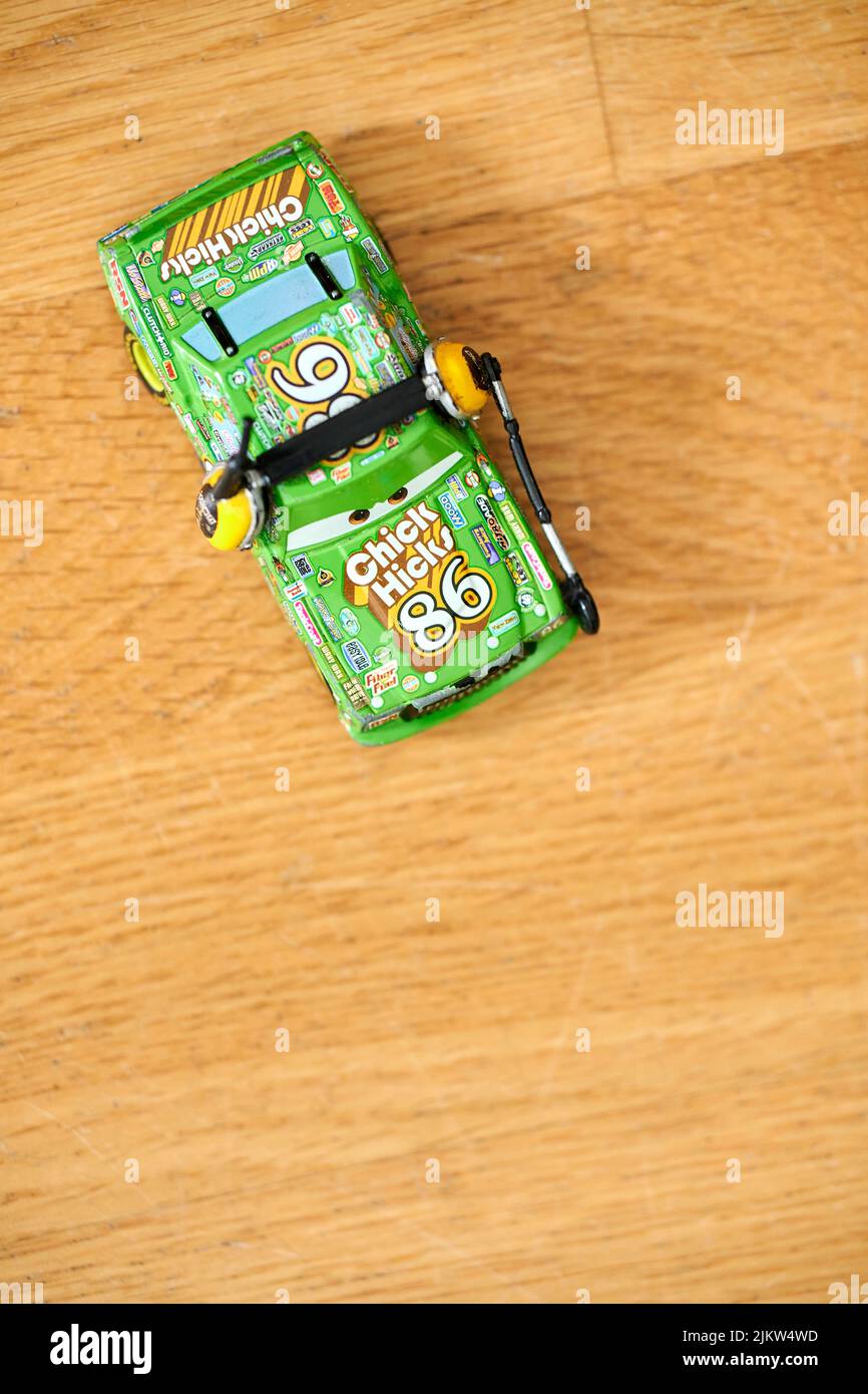 The Mattel Disney Pixar toy model car from the Cars movie on a wooden ...
