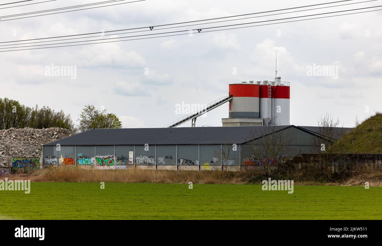 An old Dutch industrial area with graffiti on the building walls in ...