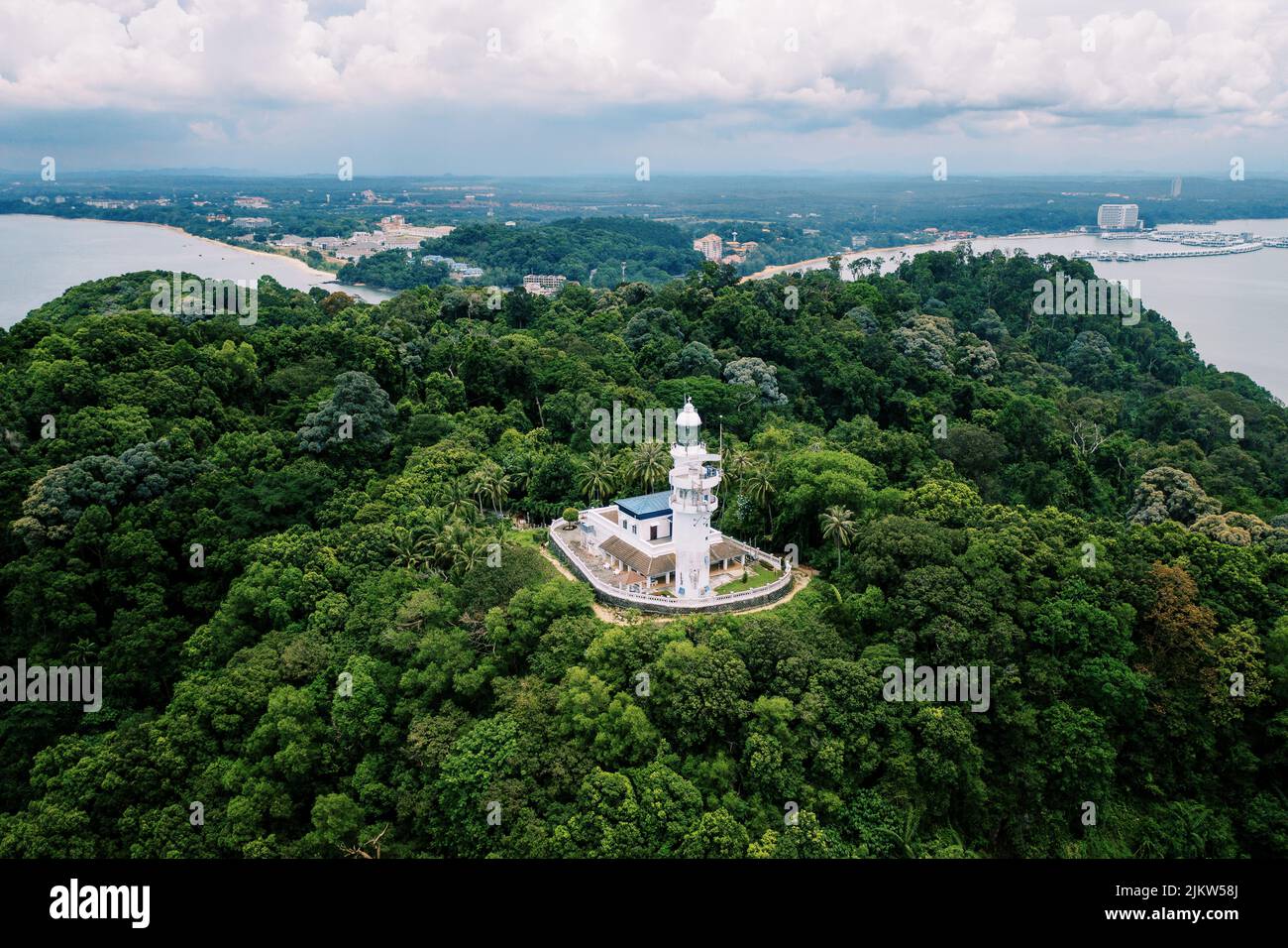 A bird's eye view of a lighthouse on top of a mountain covered with ...