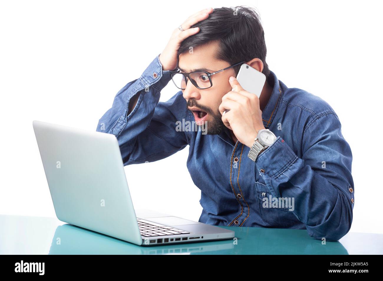 Both are looking laptop screen modern office setting hi-res stock ...