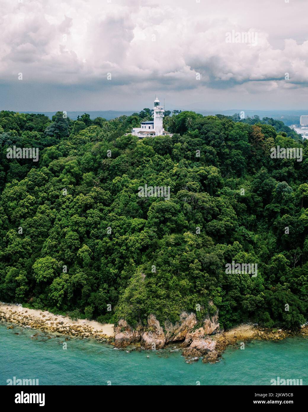 A bird's eye view of a lighthouse on top of a mountain covered with ...
