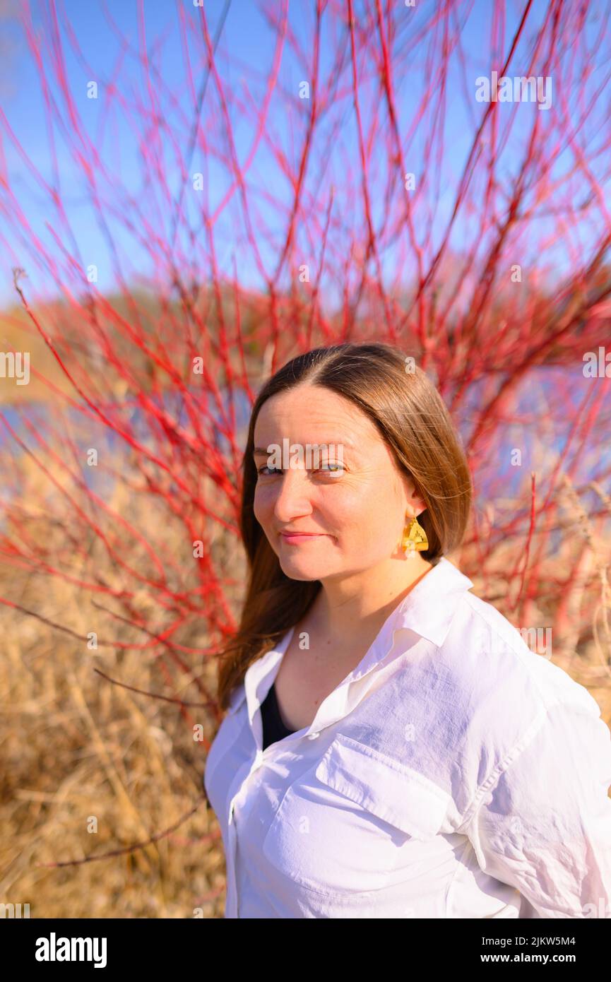 Woman behind bush hi-res stock photography and images - Alamy