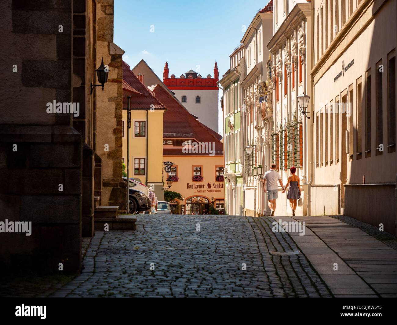 People in the old town walking around. Restaurants next to the old ...