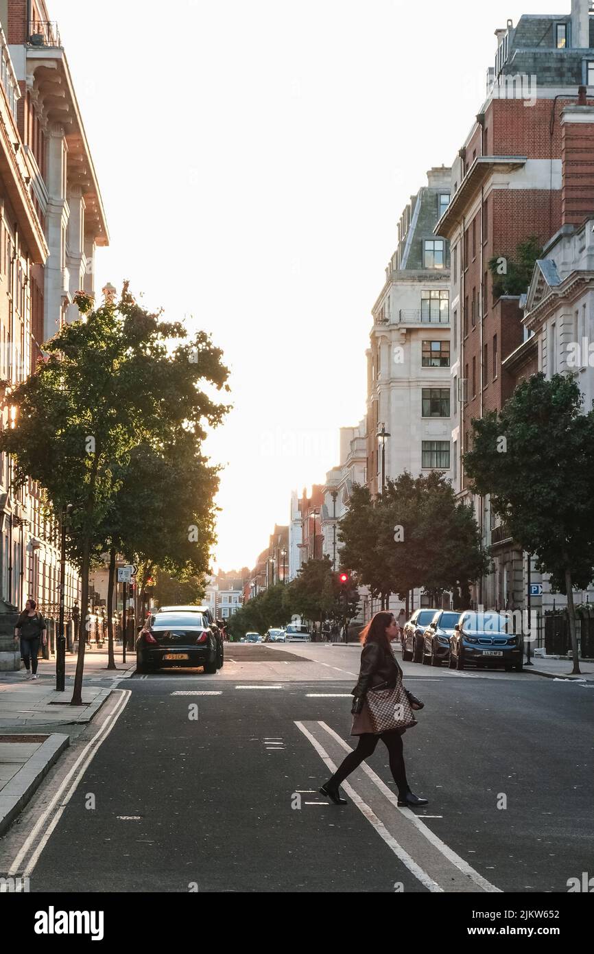 The people of London enjoying beautiful, sunny weather outside, while ...