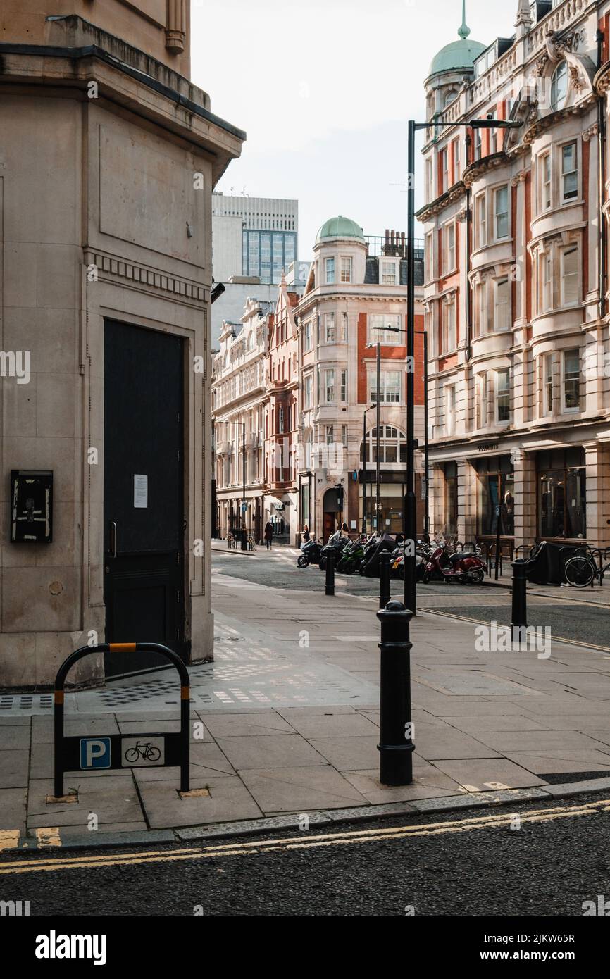 A vertical shot of an alley with historic buildings in London, UK Stock ...