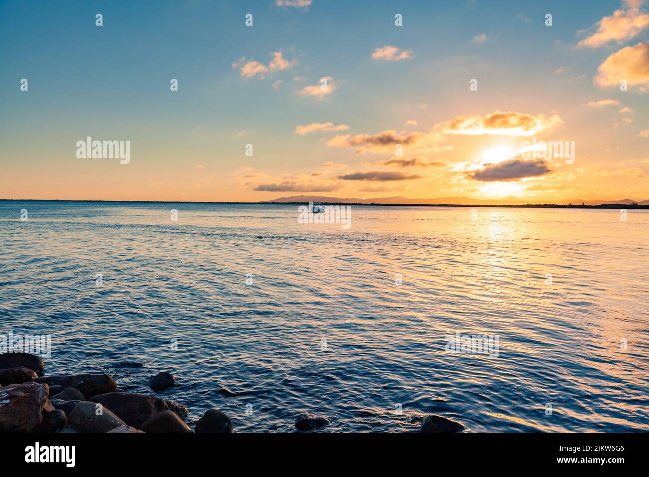 Boat at sea, golden hour Dangriga, Belize Stock Photo - Alamy